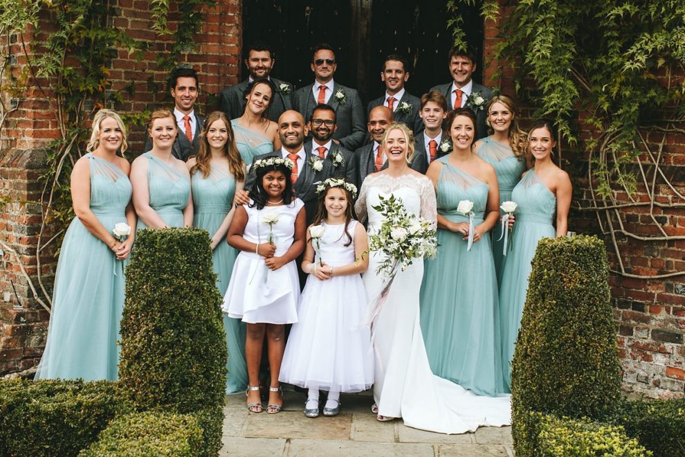 A Suzanne Neville Bride in a Classic, Long-Sleeved Lace Dress for a ...